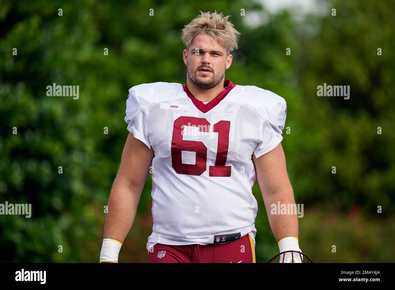 Washington Commanders center Jon Toth (61) arrives for practice at the ...