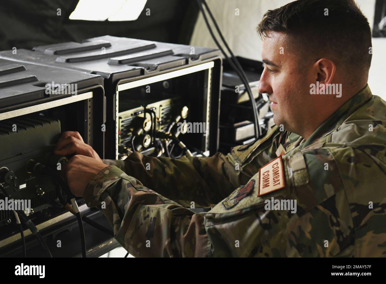 An Airman assigned to the 123rd Air Control Squadron establish a ...