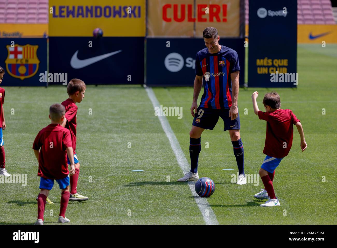 Polish forward Robert Lewandowski plays with children during the ...