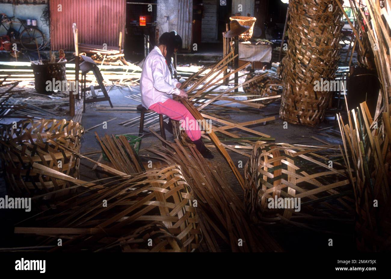 Woman weaving rattan-ware baskets, Malaysia Stock Photo - Alamy