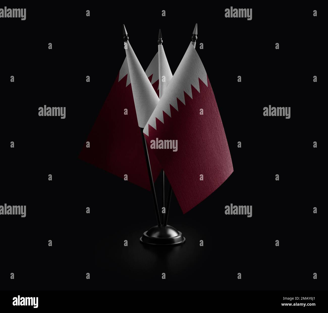 Small national flags of the Qatar on a black background Stock Photo - Alamy