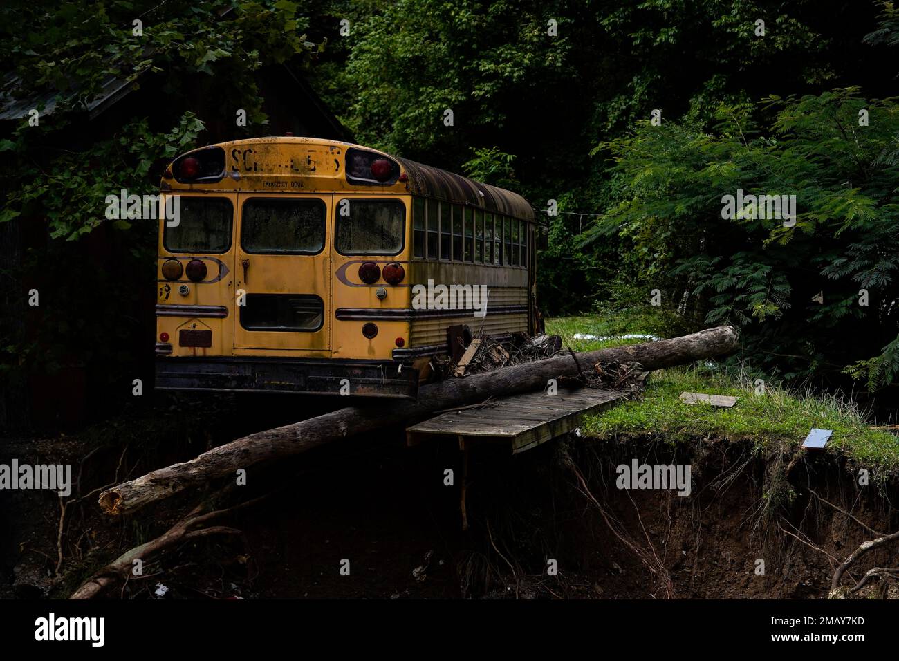 A school bus hangs off a broken bridge in Chavies, Ky., Thursday, Aug ...