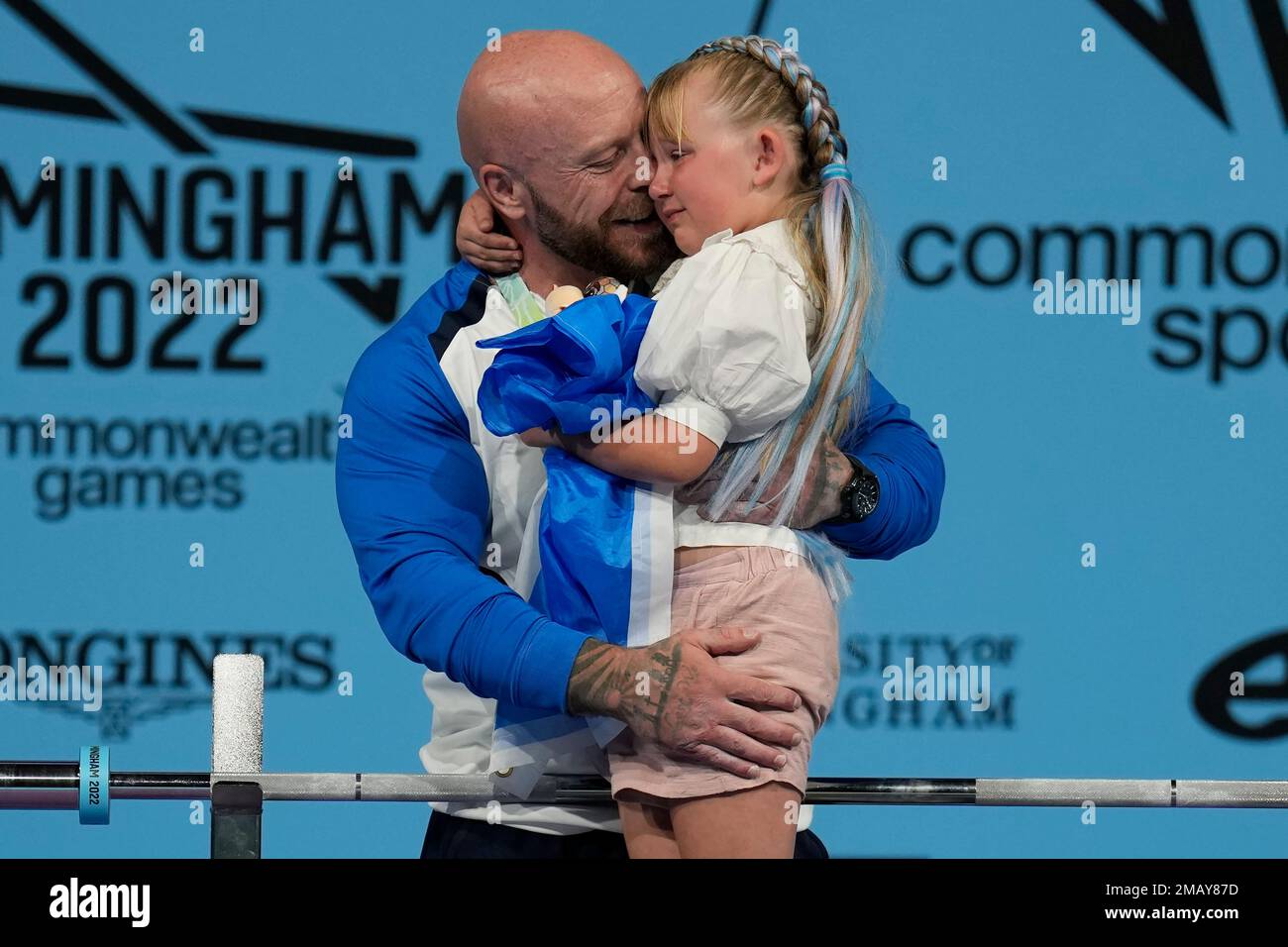 Scotland's Micky Yule hugs his daughter after winning the bronze medal ...