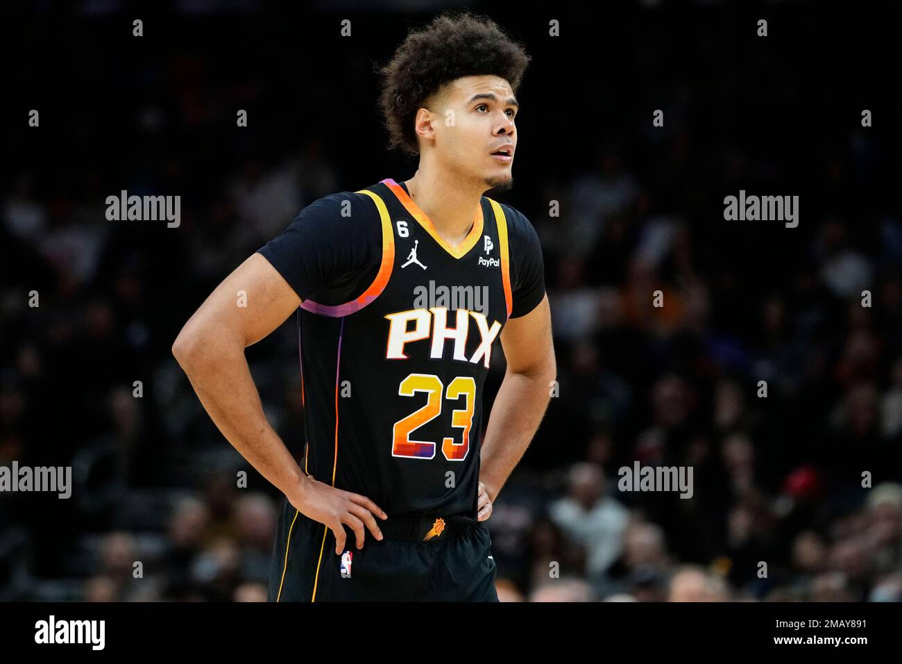 Phoenix Suns forward Cameron Johnson (23) watches play during the ...