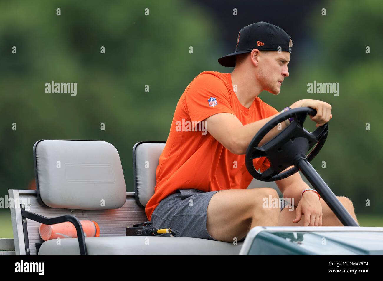 Cincinnati Bengals' Joe Burrow sits on a golf cart as watches during ...