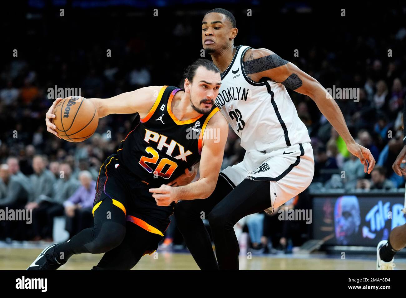 Phoenix Suns forward Dario Saric (20) drives past Brooklyn Nets center ...