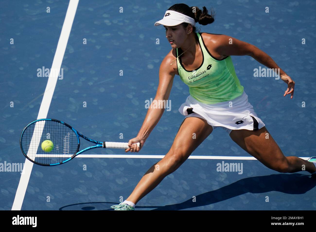 Camila Osorio, of Colombia, reaches to return a shot during a match against Emma Raducanu, of ...