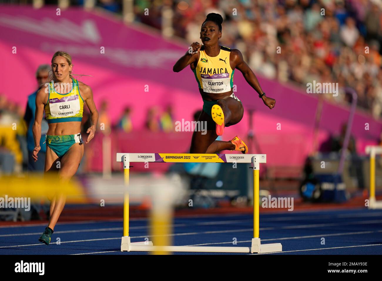 Rushell Clayton of Jamaica, right, competes in a Women's 400 meters ...