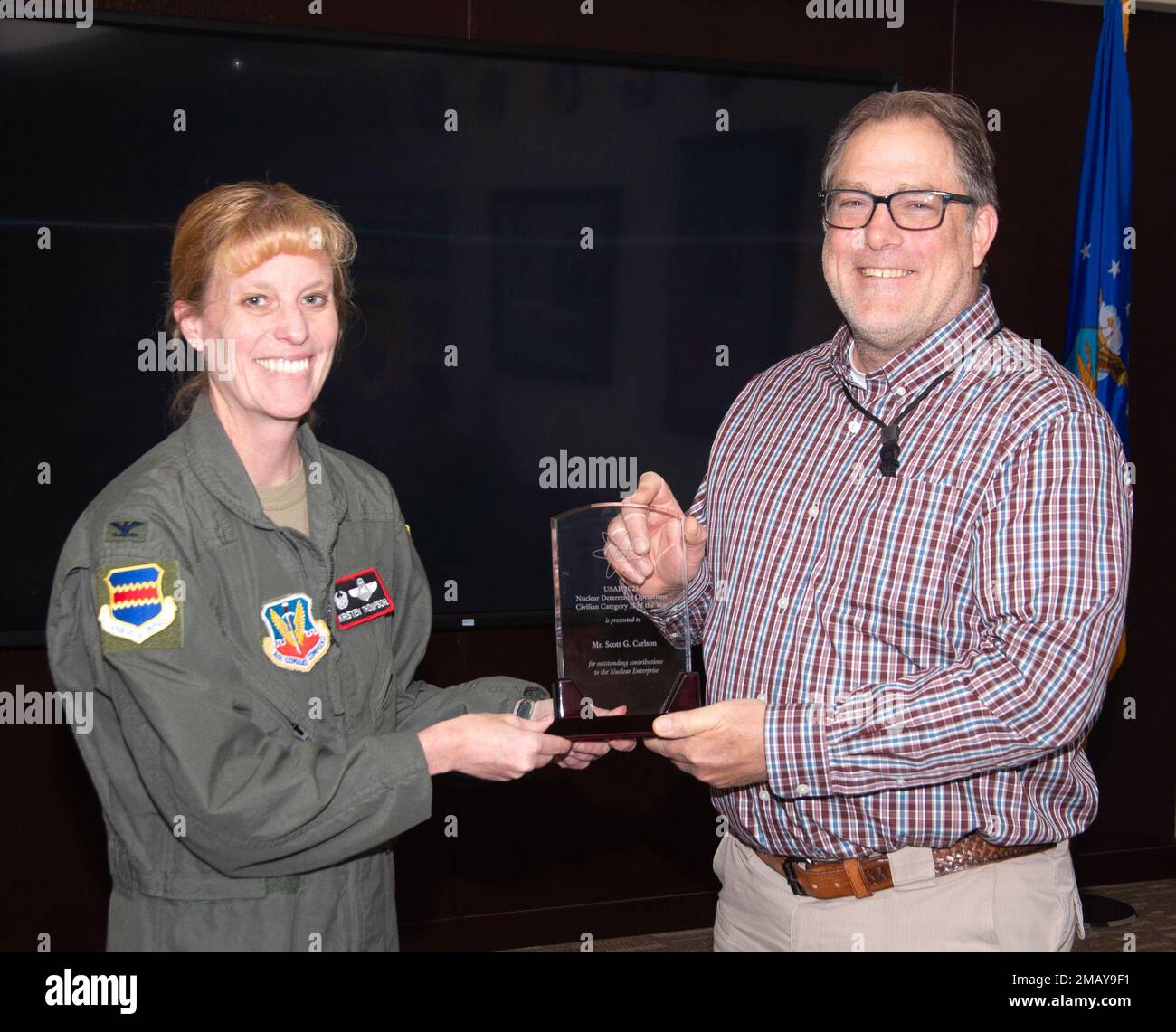 Col. Kristen Thompson, 55th Wing commander, presents Scott Carlson ...