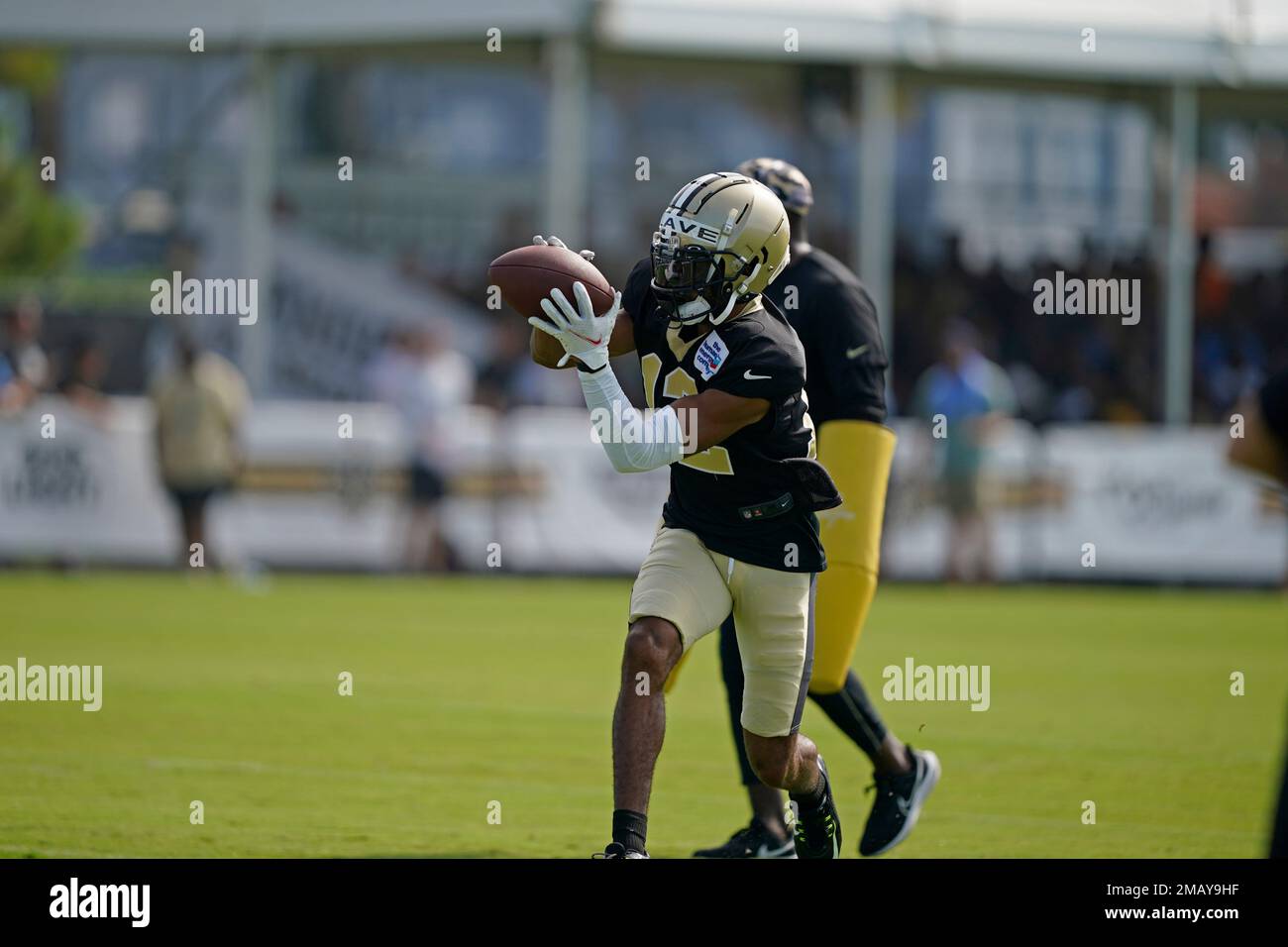 New Orleans Saints wide receiver Chris Olave (12) runs through drills during training camp at ...