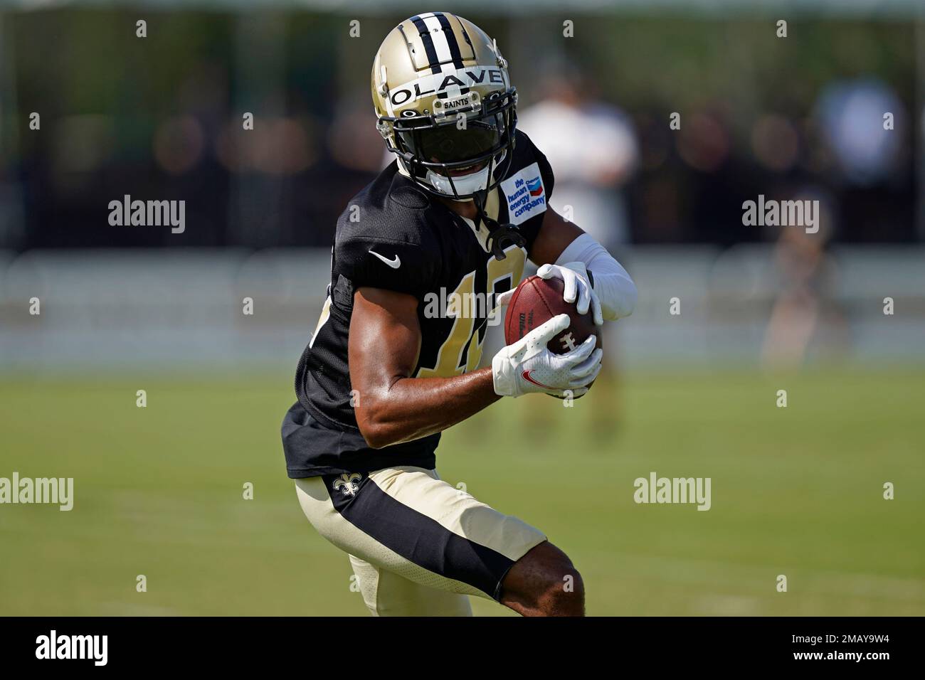 New Orleans Saints wide receiver Chris Olave (12) runs through drills ...