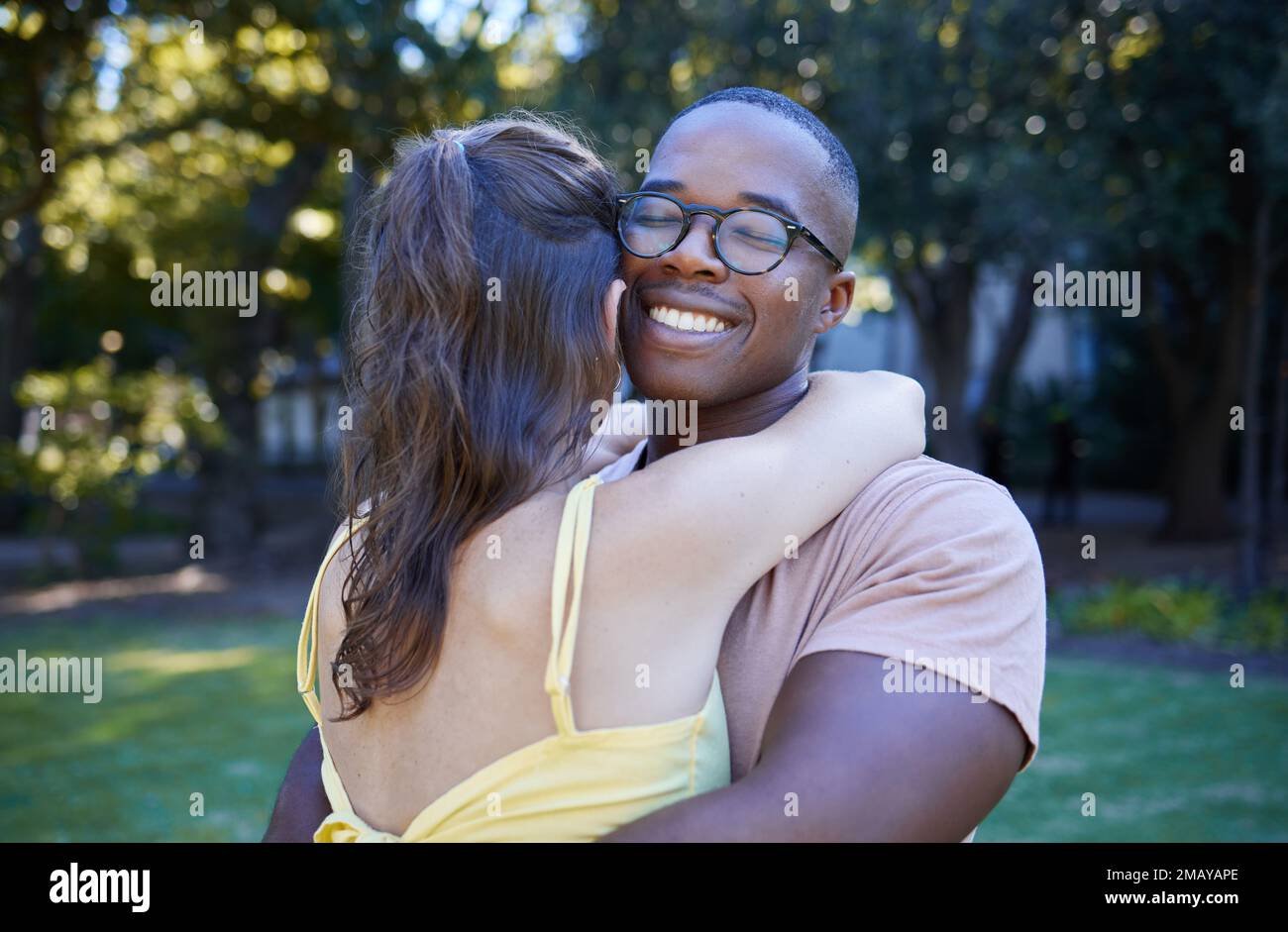 Black Man Interracial Relationship And Hug On Park Lawn With Love