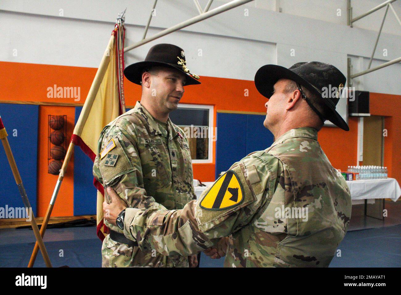 Col. Reggie Harper congratulates and thanks Lt. Col. Nick Ryan for a ...