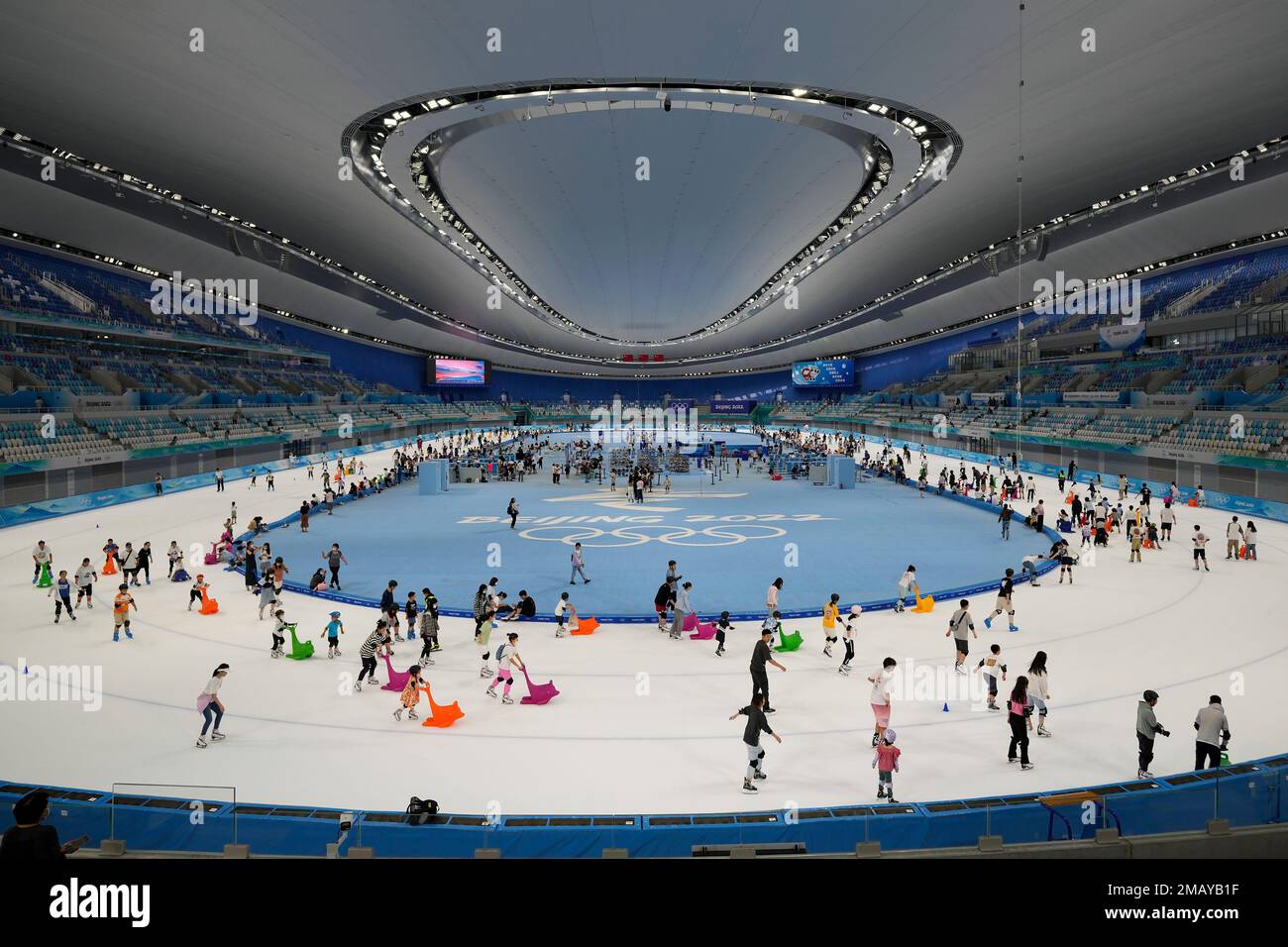 People skate on the ice at the National Speed Skating Oval after being ...