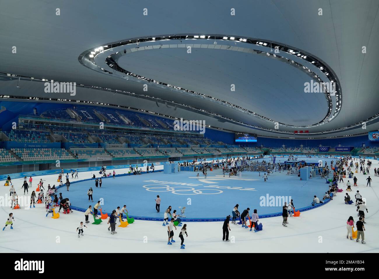 People skate on the ice at the National Speed Skating Oval after being ...