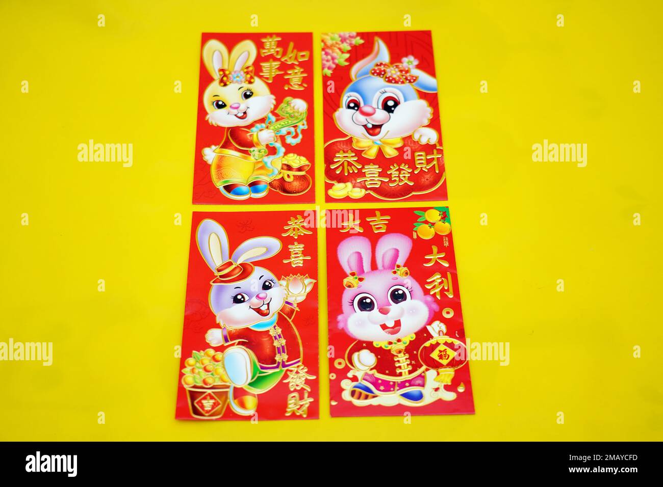 Theme red envelopes with rabbit, Chinese blessing words on yellow ...