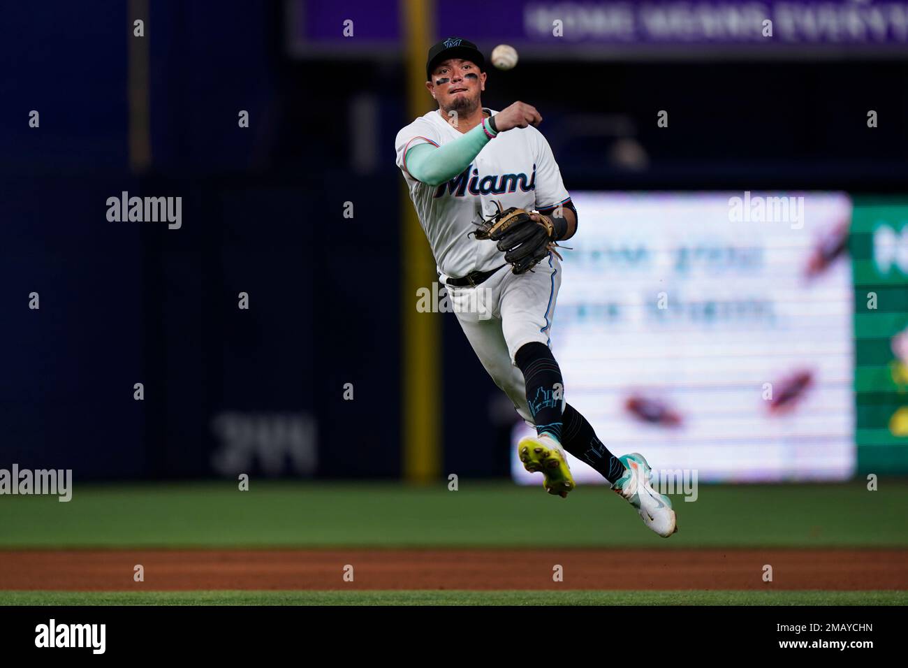 Miami Marlins shortstop Miguel Rojas throws to first to put out ...