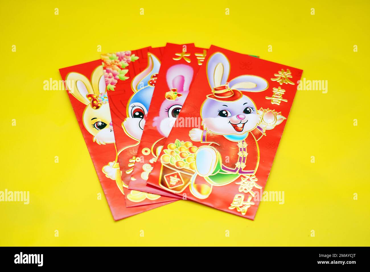 Theme red envelopes with rabbit, Chinese blessing words on yellow ...