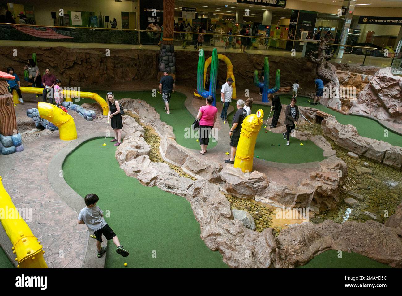 People play miniature golf inside the West Edmonton Mall, owned by ...