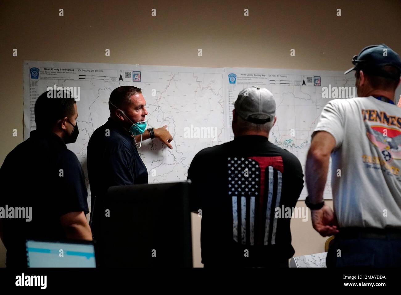 K. Scott Dean, center, the assistant chief, of the Miami fire and ...