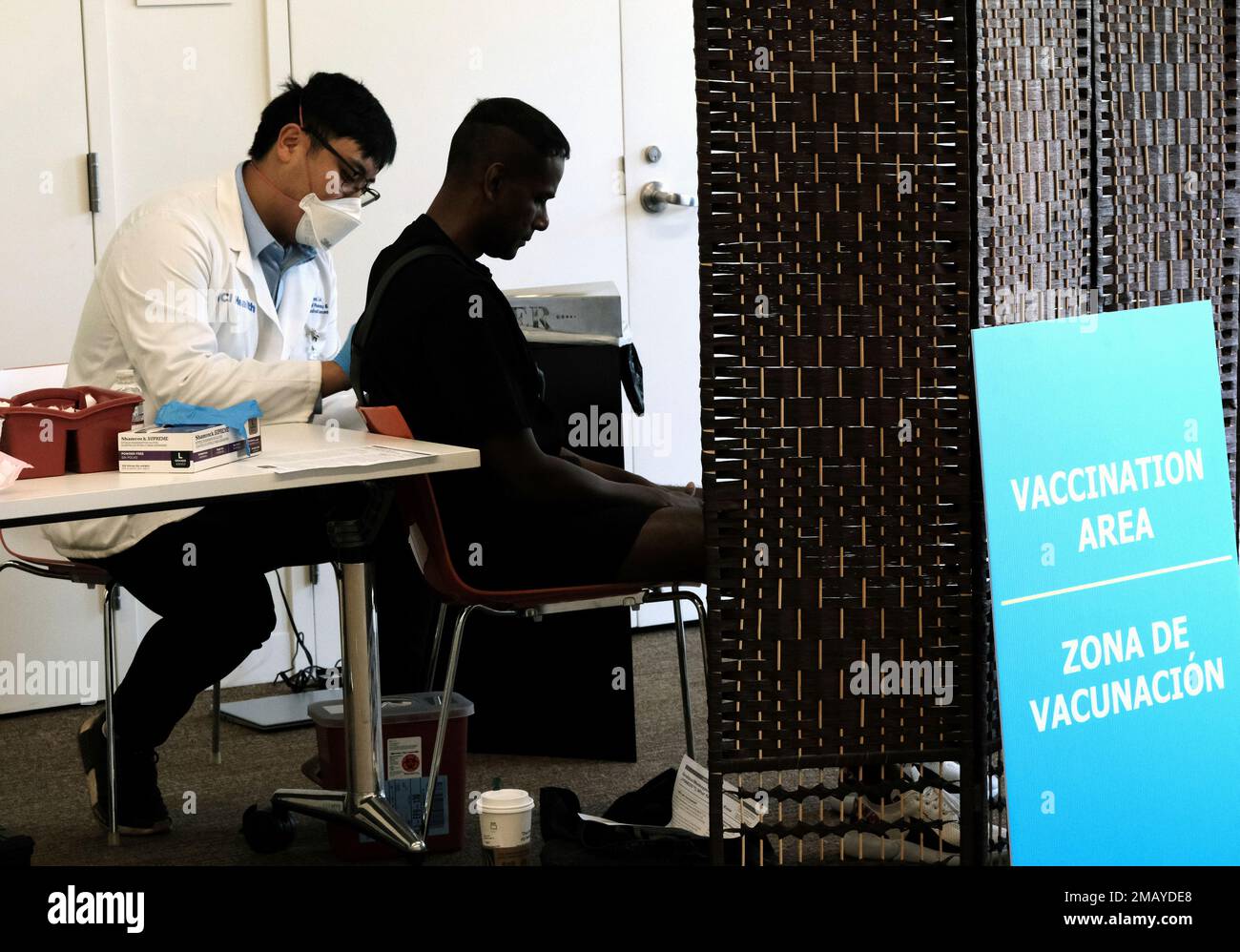 A patient receives a Monkeypox vaccination at a Pop-Up vaccination site ...