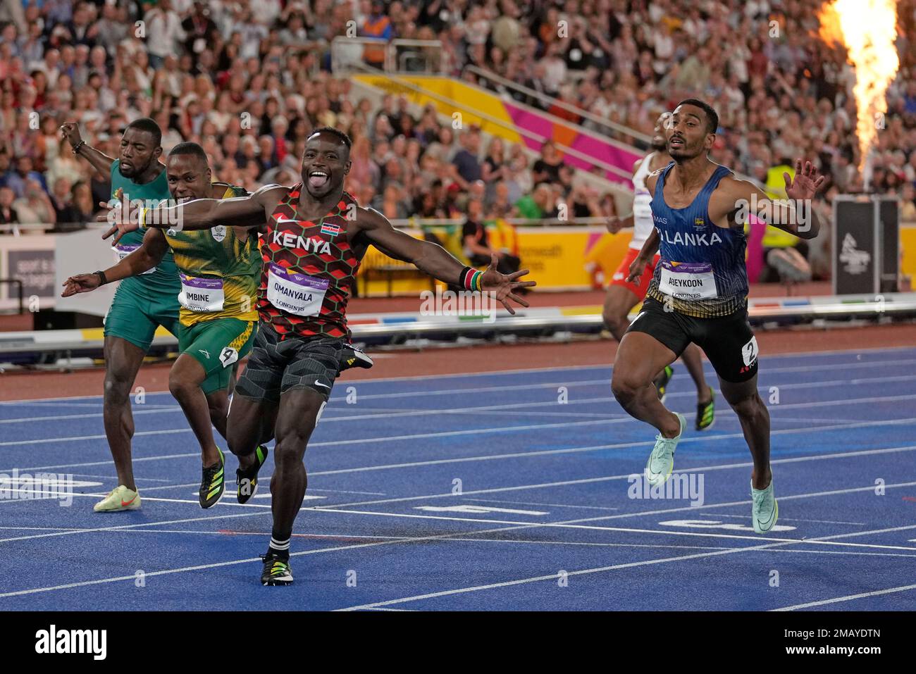 Kenya's Ferdinand Omanyala celebrates as he wins gold in the men's 100m ...