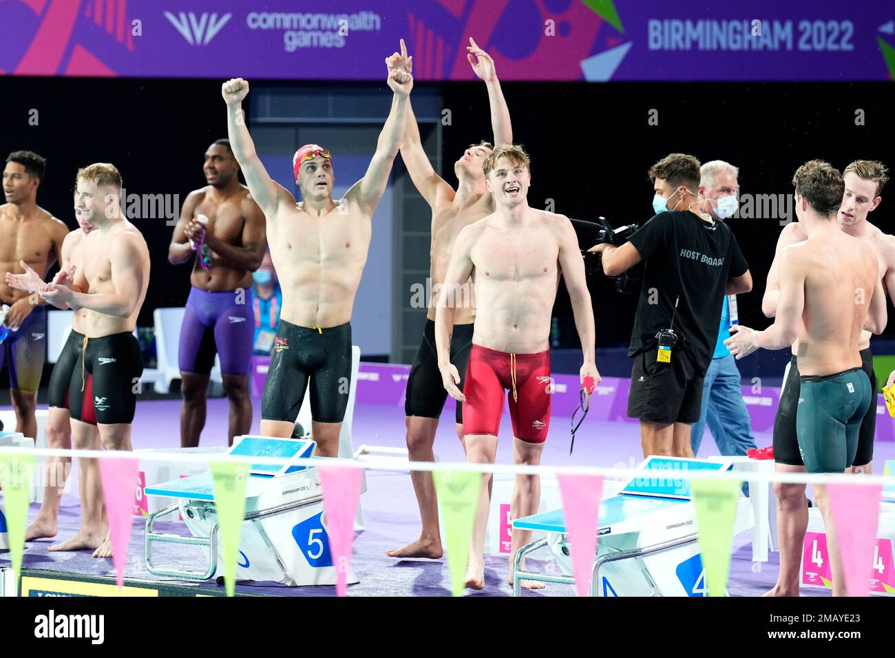 Team England swimmers, center, celebrate after winning the gold medal ...