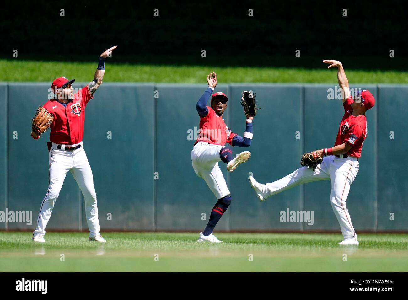 Minnesota Twins' left fielder Jake Cave, left, center fielder Nick ...