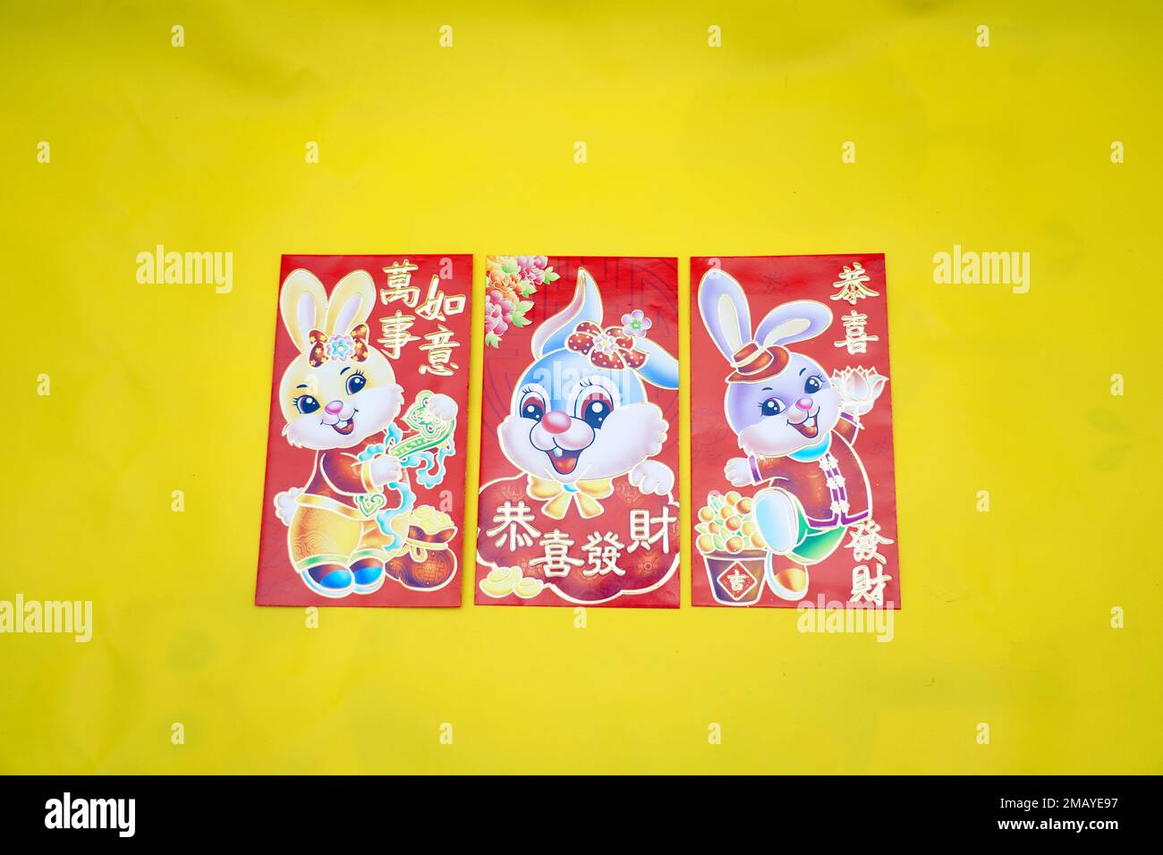 Theme red envelopes with rabbit, Chinese blessing words on yellow ...