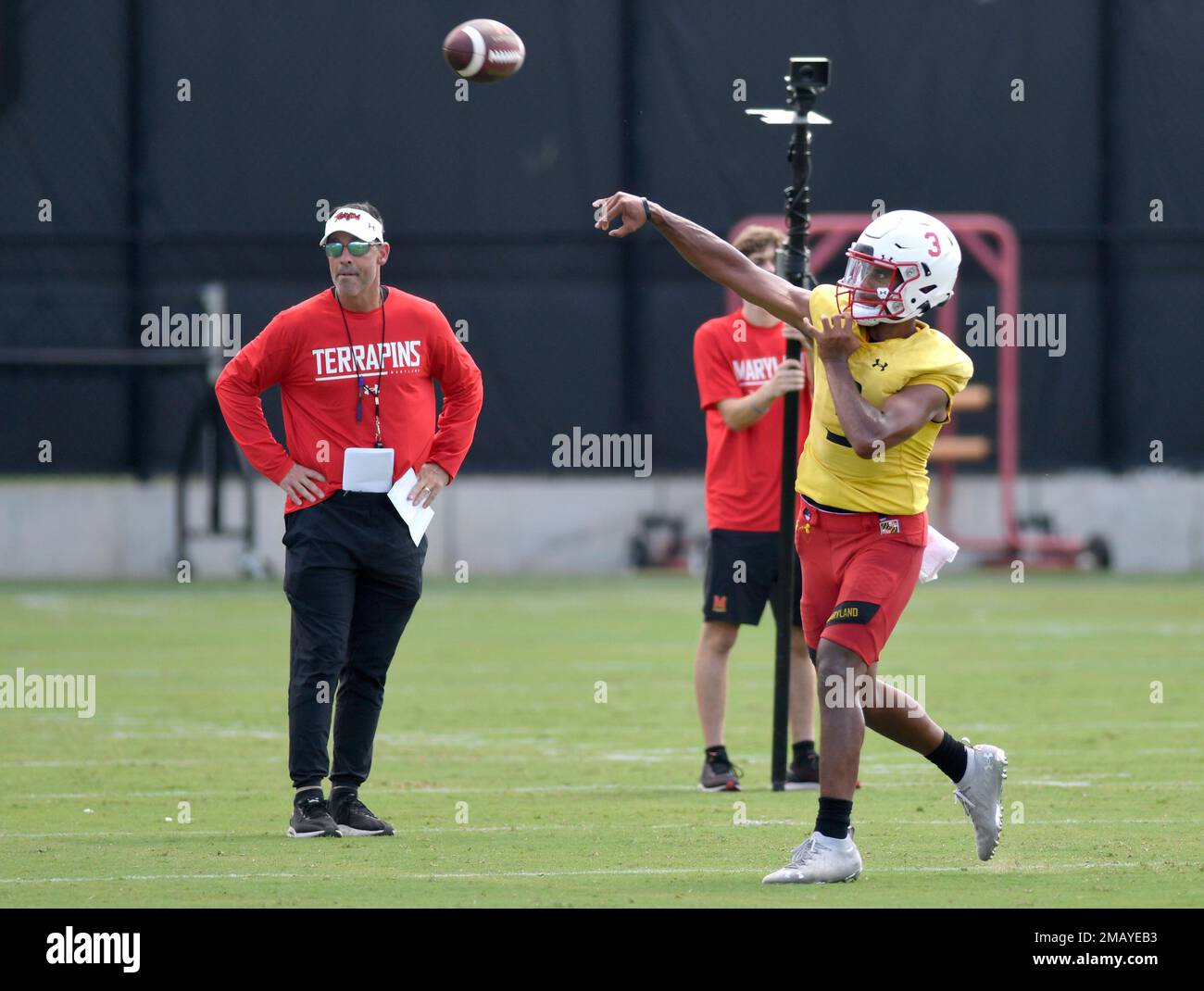 Maryland quarterback Taulia Tagovailoa, right, passes as offensive ...
