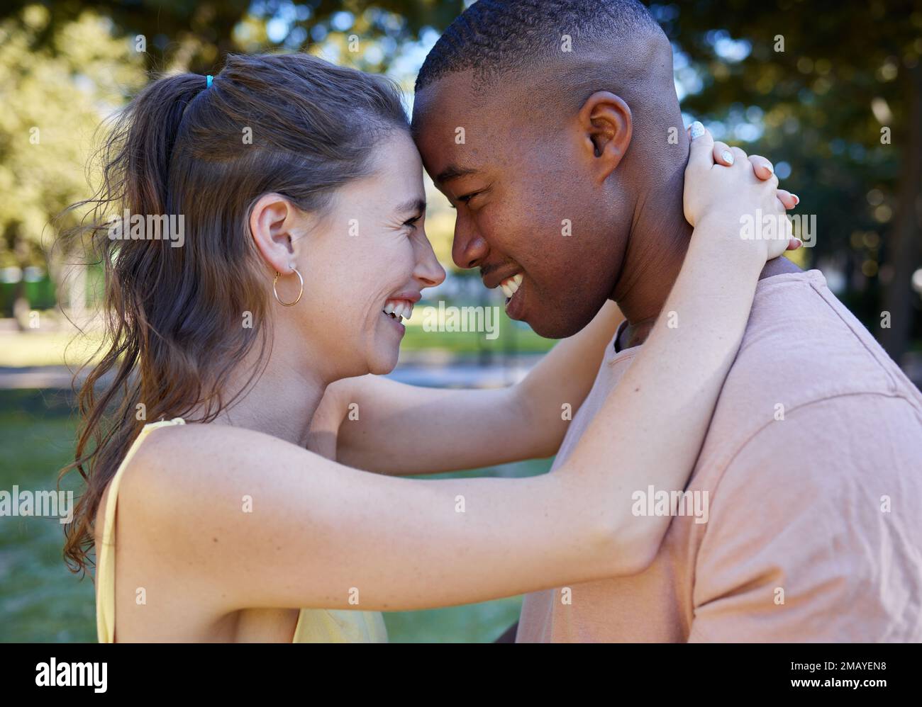 Happy, love and interracial couple at park for date with diversity ...