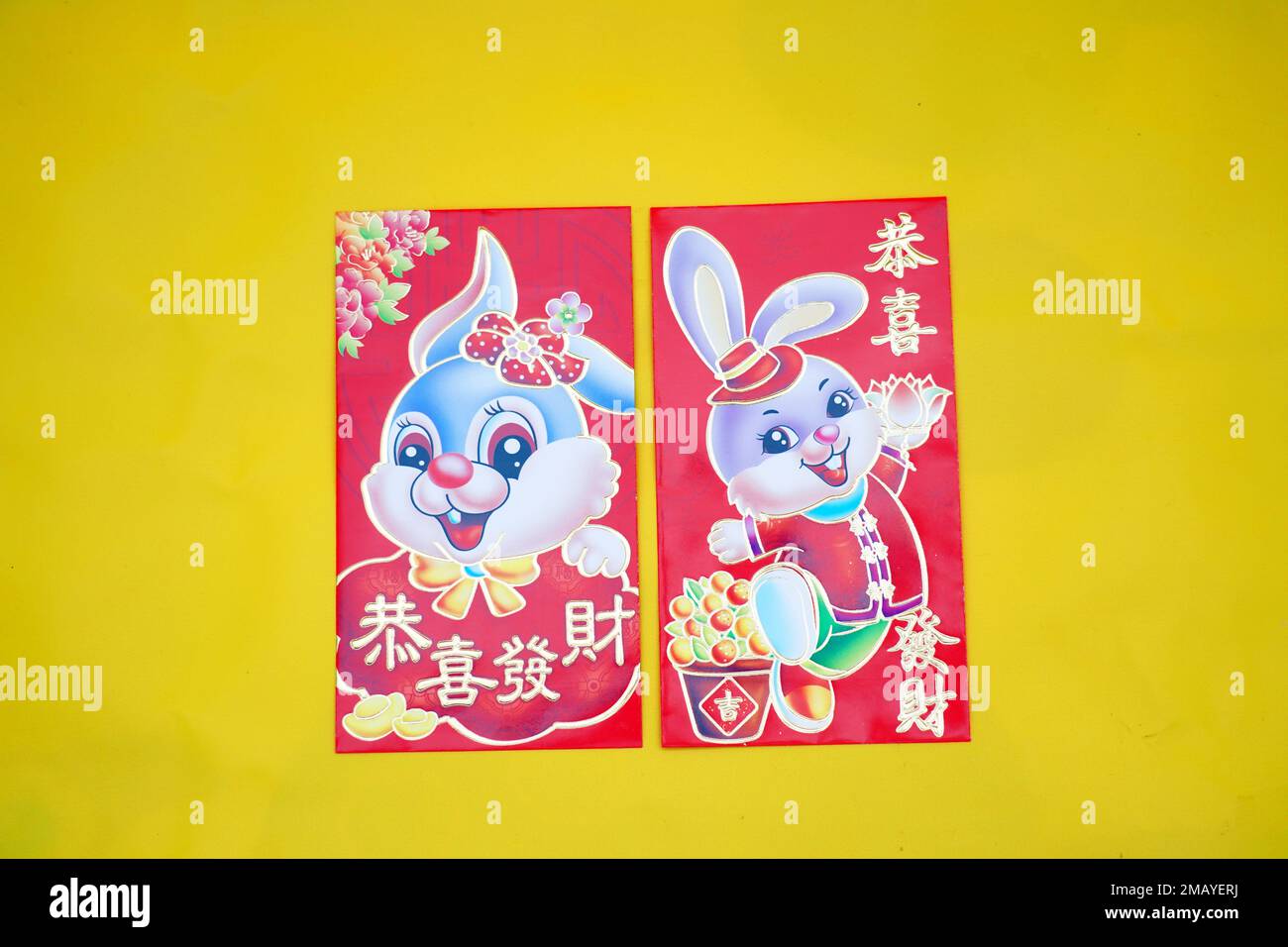 Theme red envelopes with rabbit, Chinese blessing words on yellow ...