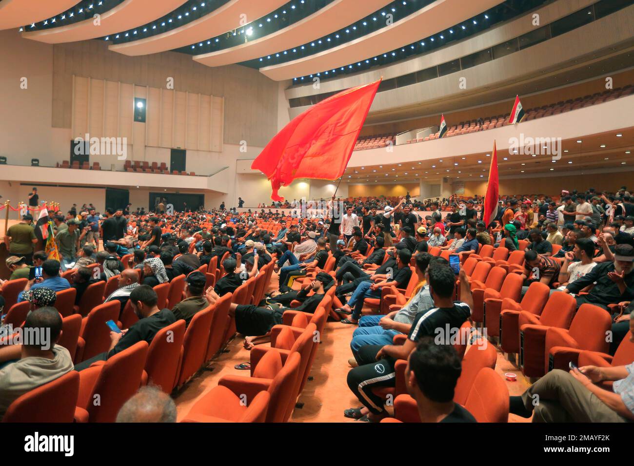 Followers of Shiite cleric Muqtada al-Sadr fill the parliament building ...