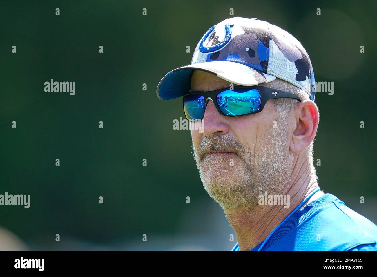 Fans are reflected in the sunglasses of Indianapolis Colts head coach ...