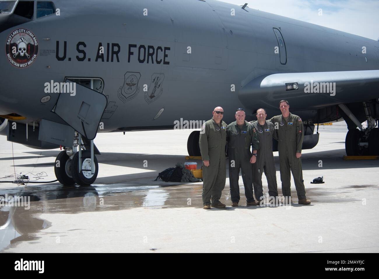 Air Force Lt Col Dan Hale poses with the crew of his fini-flight at ...