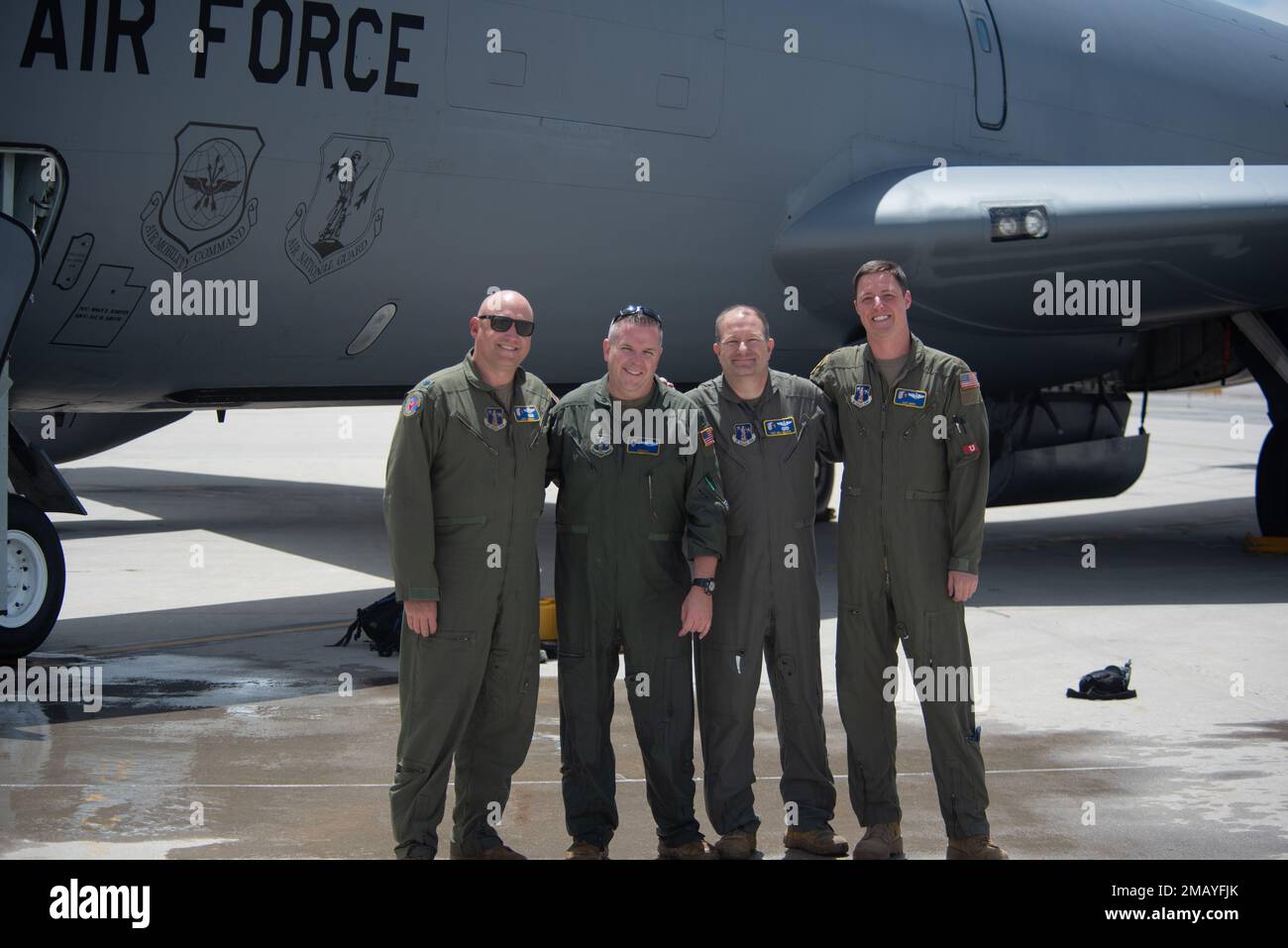 Air Force Lt Col Dan Hale poses with the crew of his fini-flight at ...
