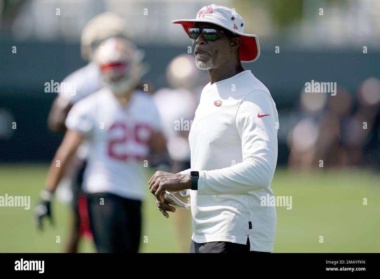 FILE - San Francisco 49ers assistant coach Johnny Holland watches as ...