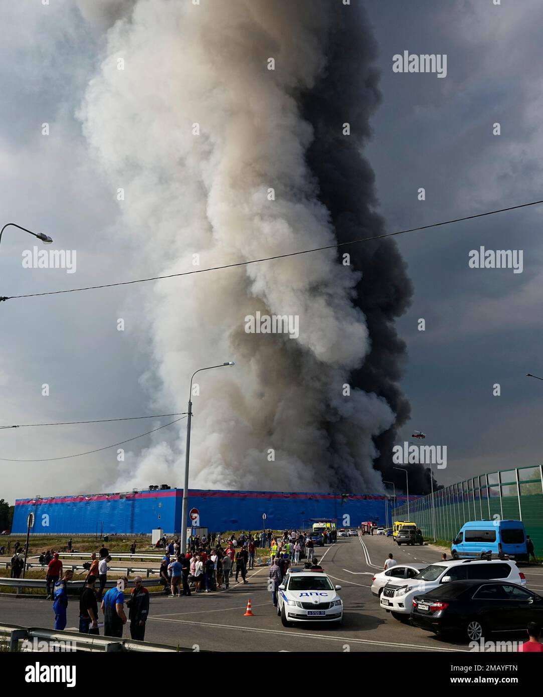 Smoke rises over a burning warehouse of the online retailer Ozon in ...