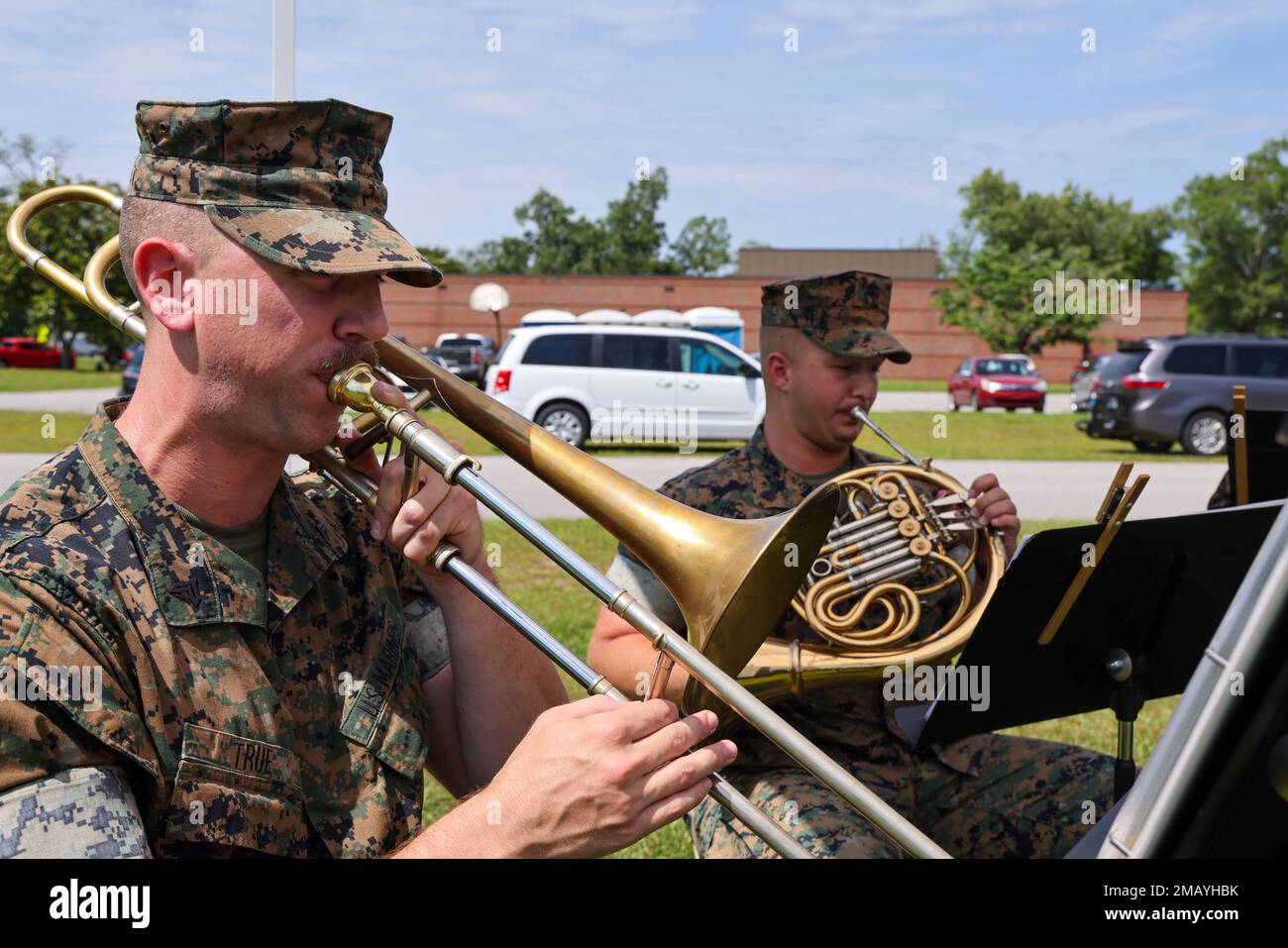U.S. Marine Corps Cpl. Nicholas True plays the trombone during the II ...