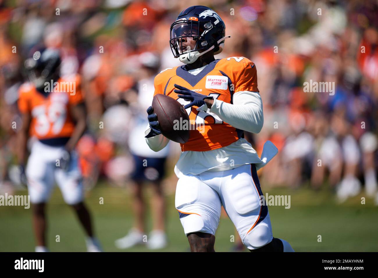 Denver Broncos running back Mike Boone takes part in drills during the ...