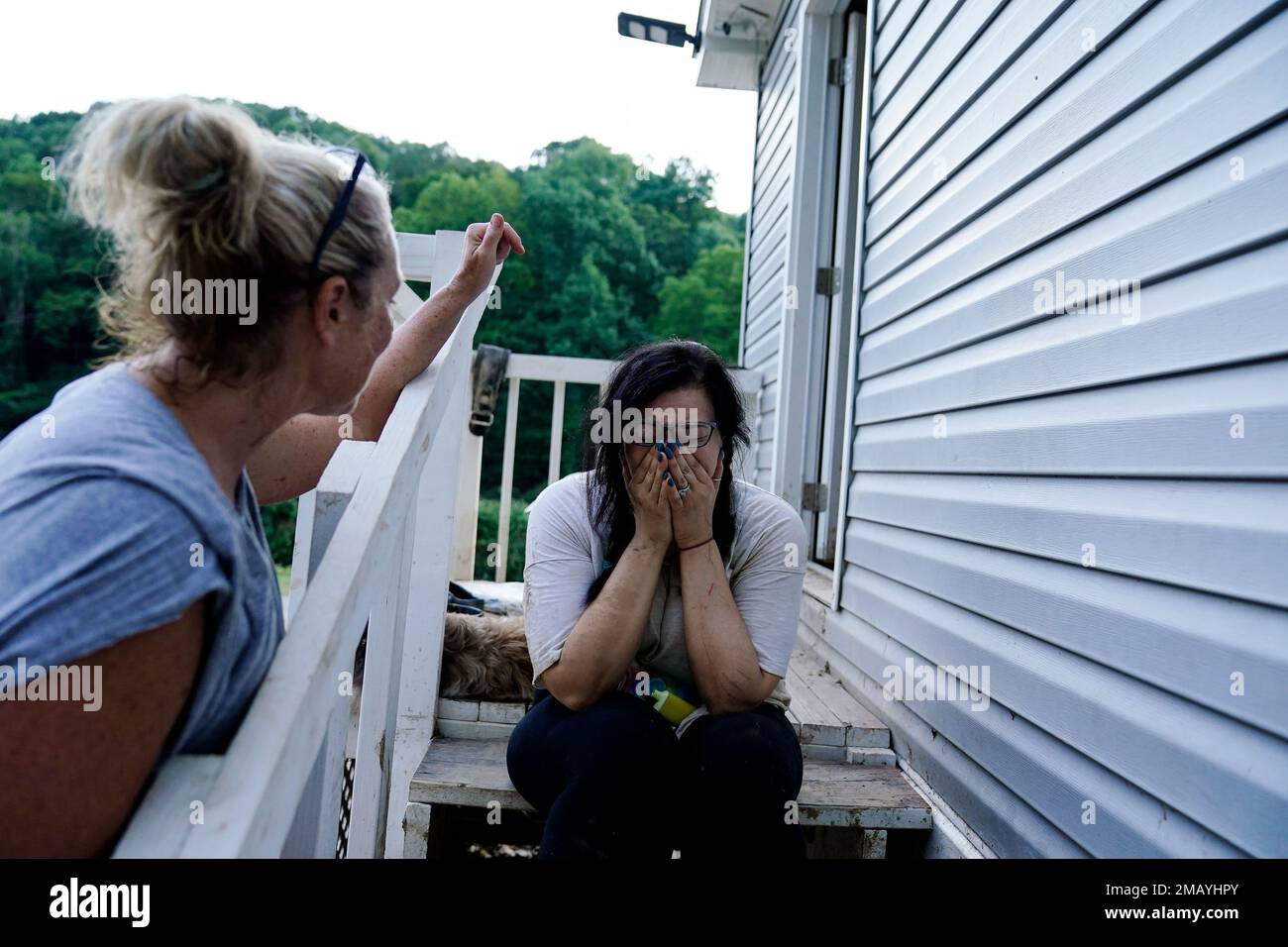 Kirsten Gomez, right, cries to her family member Kathy Hall, left, after what she calls a quiet ...