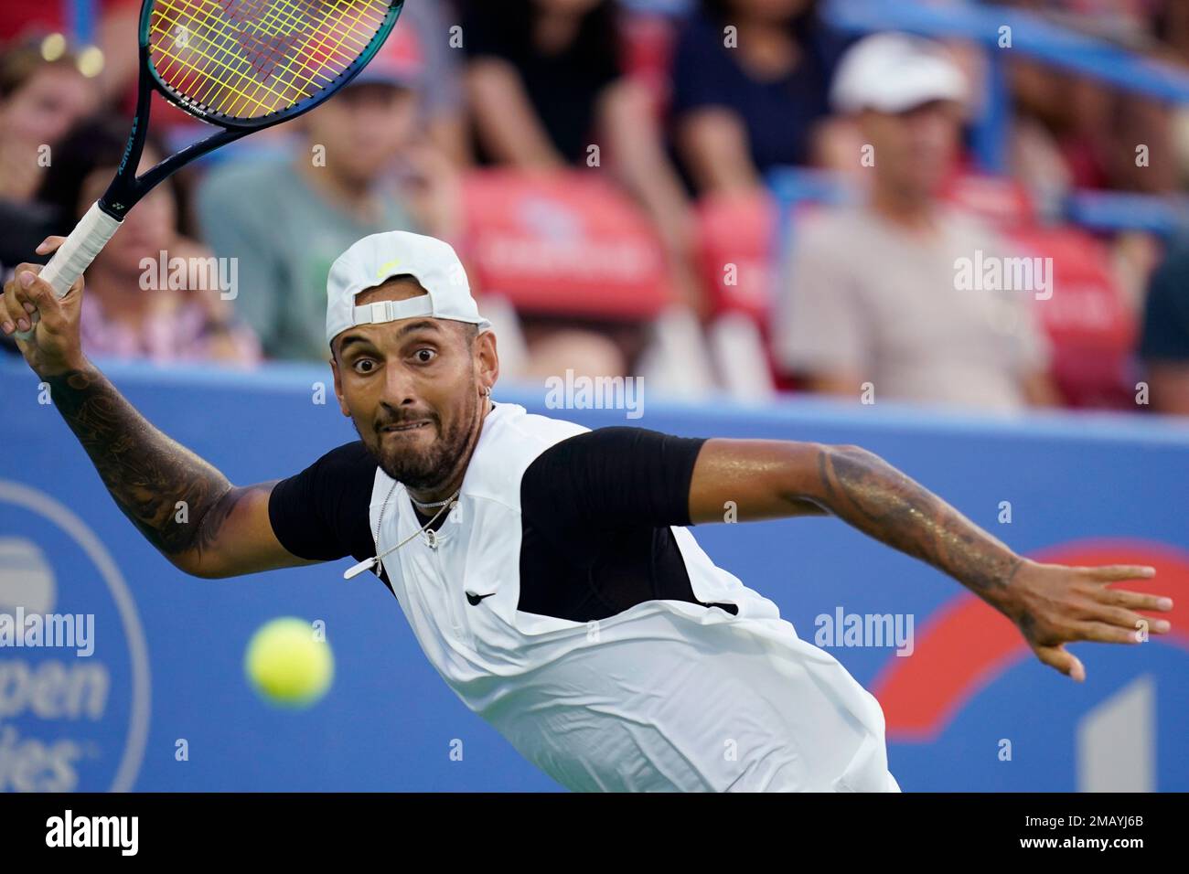 Nick Kyrgios, of Australia, prepares to hit a forehand to Marcos Giron ...