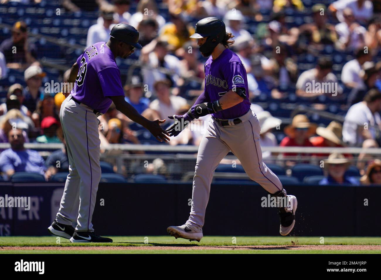 Colorado Rockies' Brendan Rodgers, right, celebrates with third base ...