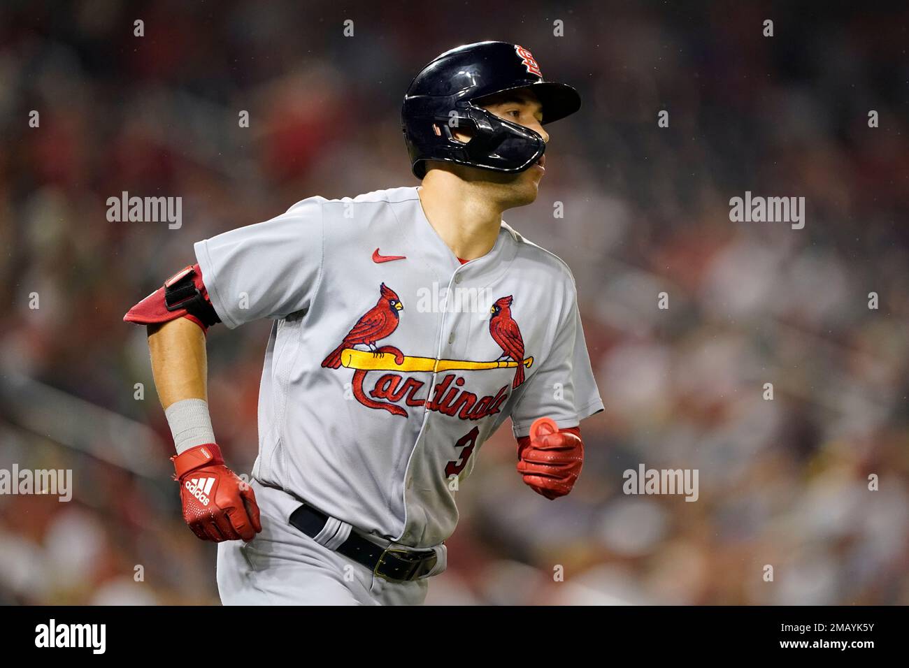 St. Louis Cardinals' Dylan Carlson runs down the first base line during ...