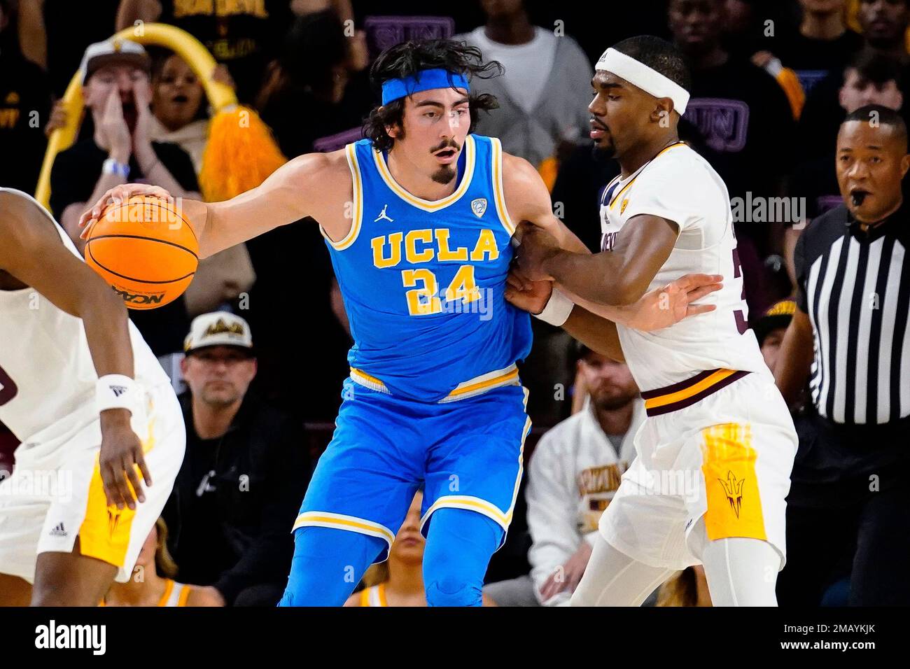 UCLA's Jamie Jaquez Jr. (24) is defended by Arizona State's Devan ...