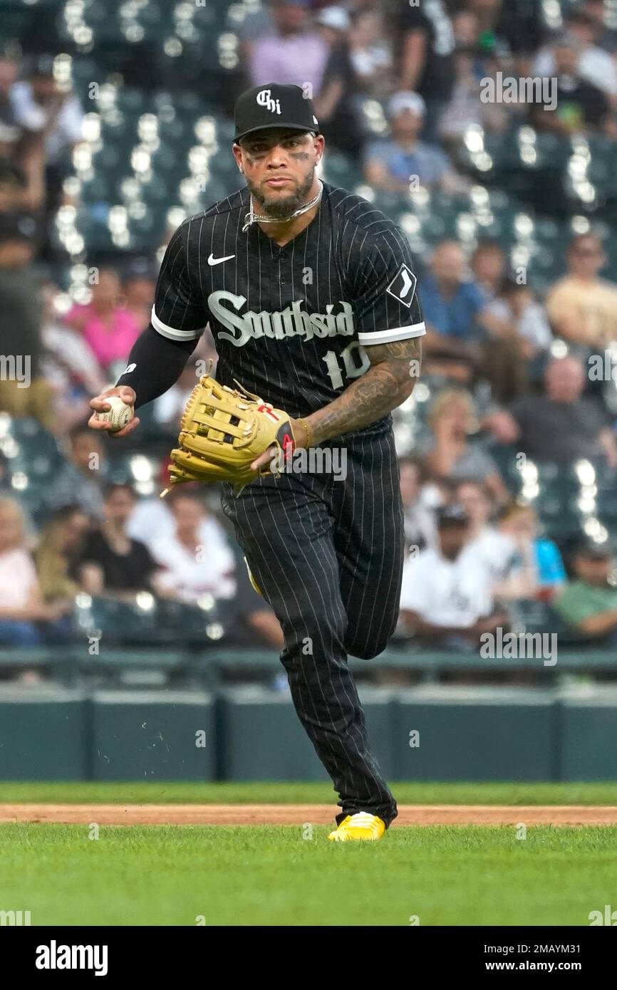 Chicago White Sox third baseman Yoan Moncada looks to throw to first ...