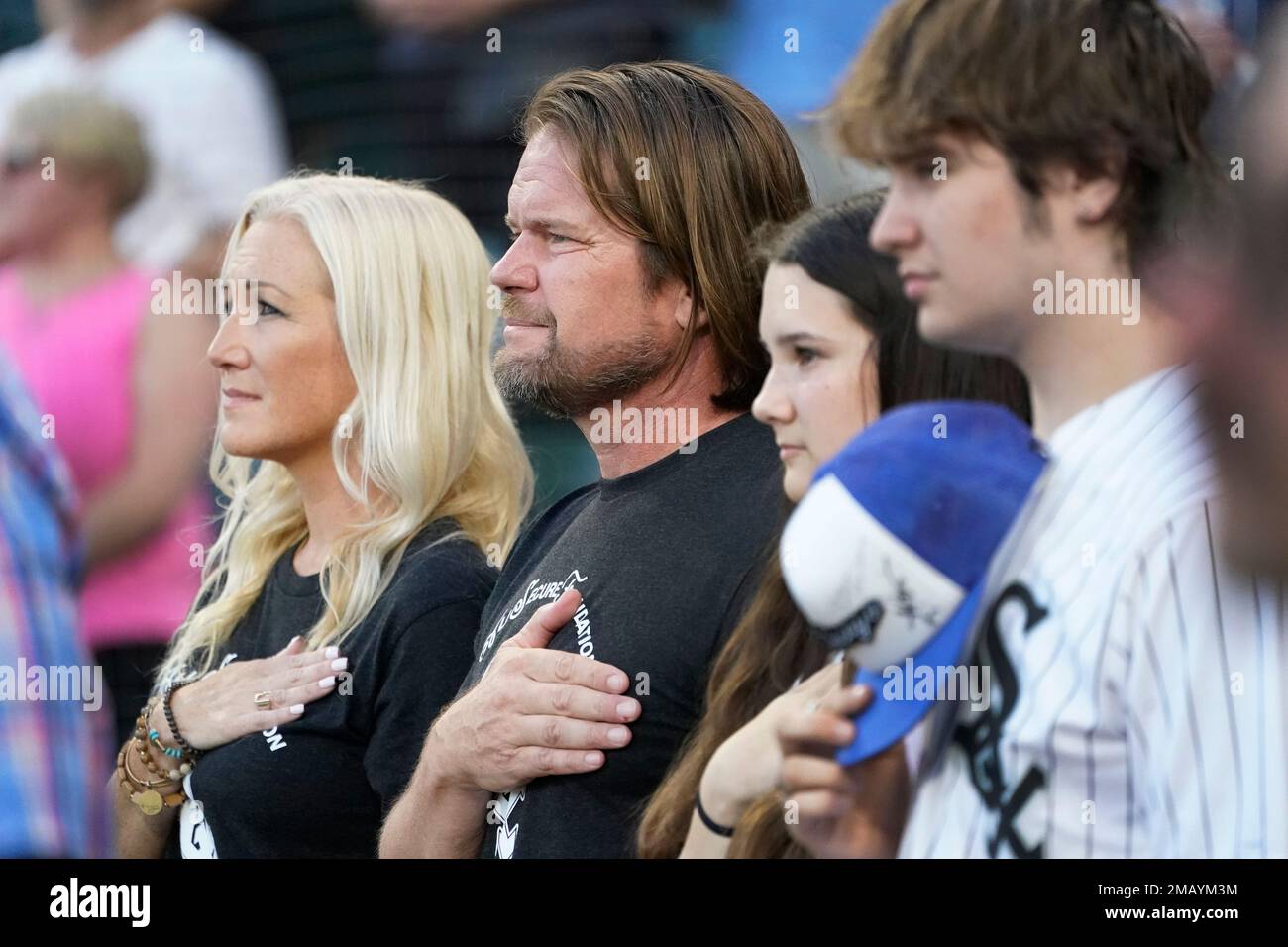 US Army Command Sgt. Major Ret., Tom Satterly, center, and his wife Jen ...