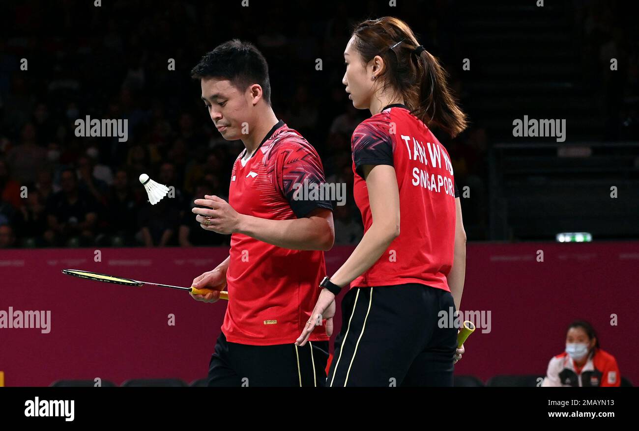 Singapore's Jessica Wei Han Tan, right, talks to Singapore's Yong Kai ...