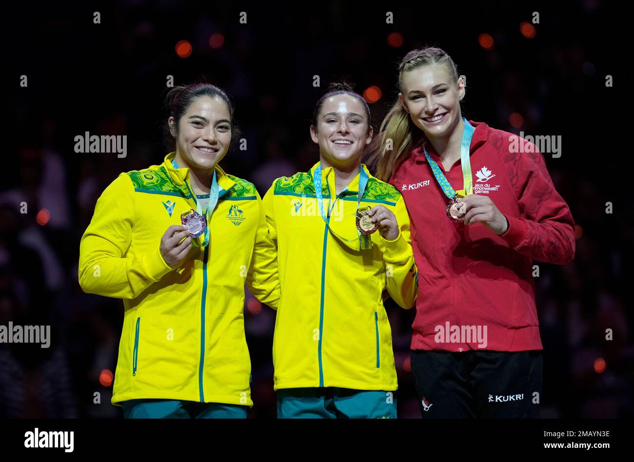 Gold medal winner Kate McDonald of Team Australia, center, poses with ...