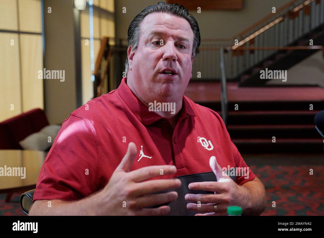 Oklahoma offensive coach Bill Bedenbaugh speaks during an NCAA college ...